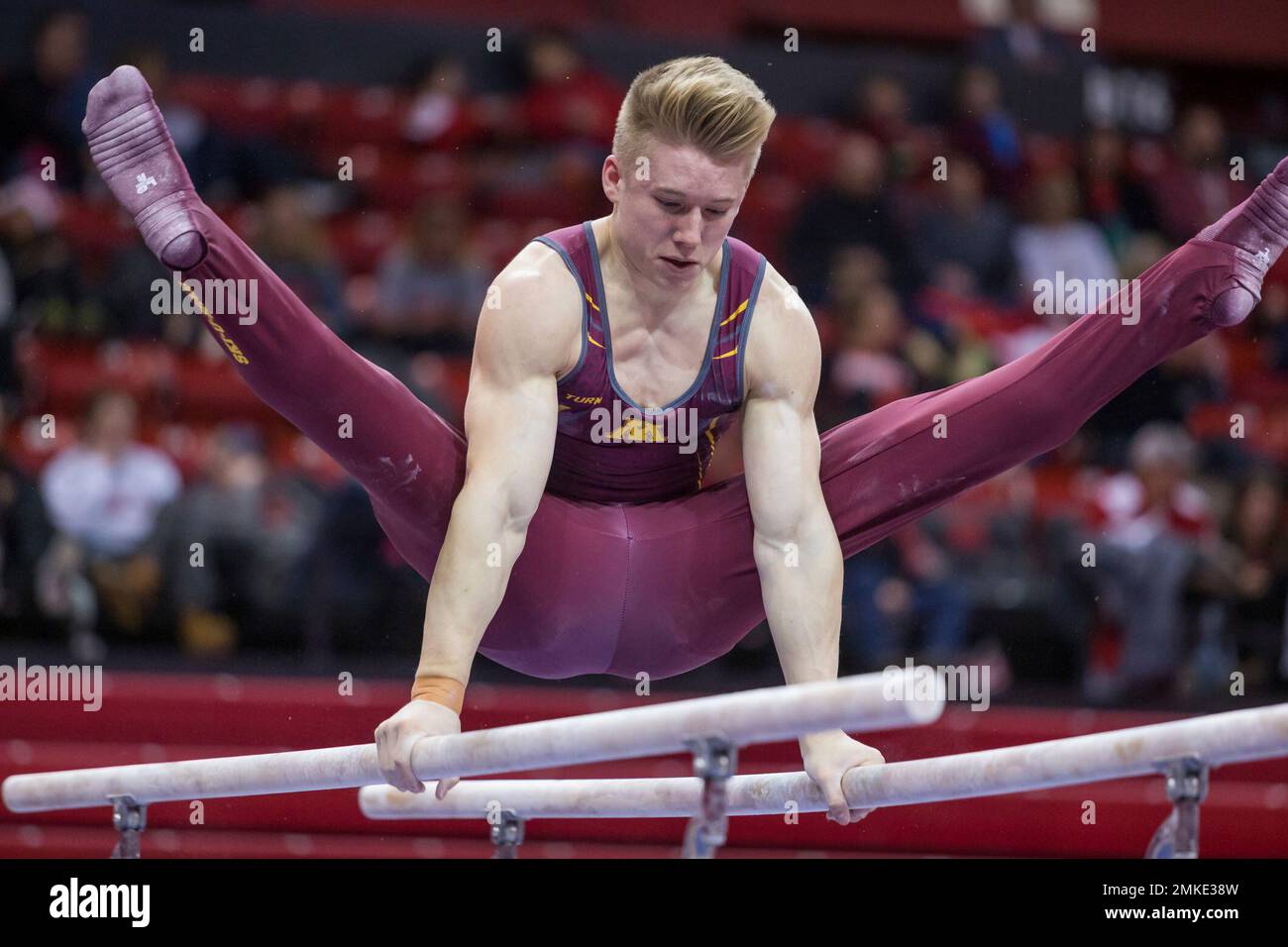 Minnesota's Shane Wiskus performing on the parallel bars during a ...