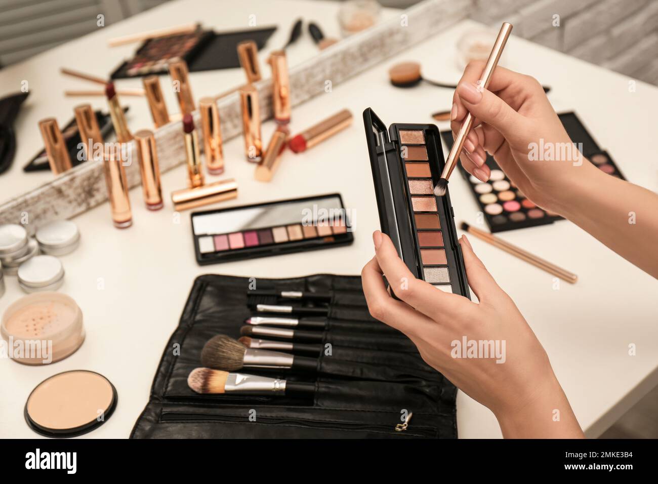 Professional makeup artist with eyeshadow palette Stock Photo - Alamy