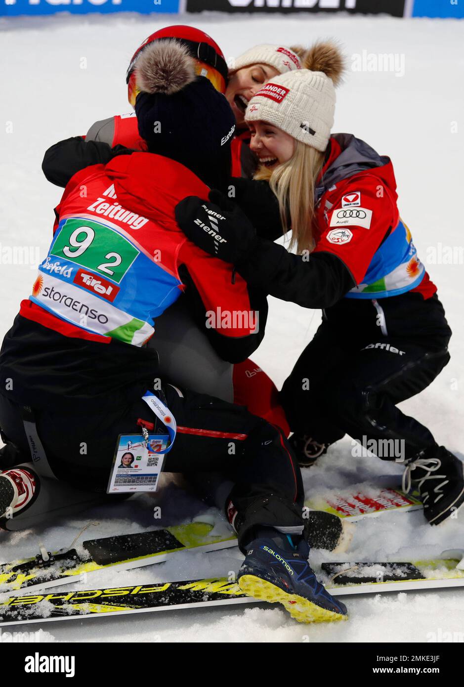 The Austrian team celebrates winning the silver medal in the women's ...