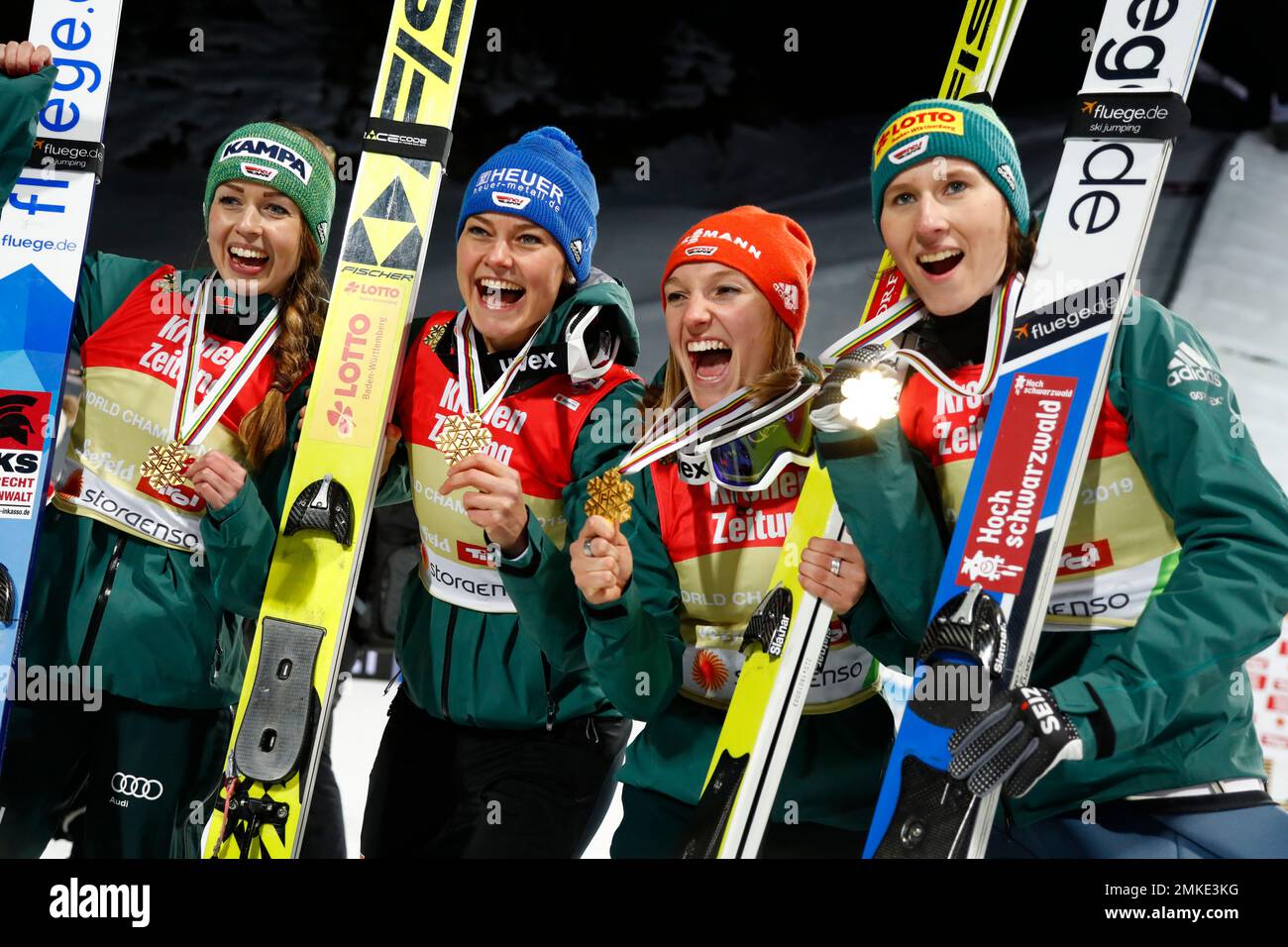 The German team show their gold medals after the women's team ski ...