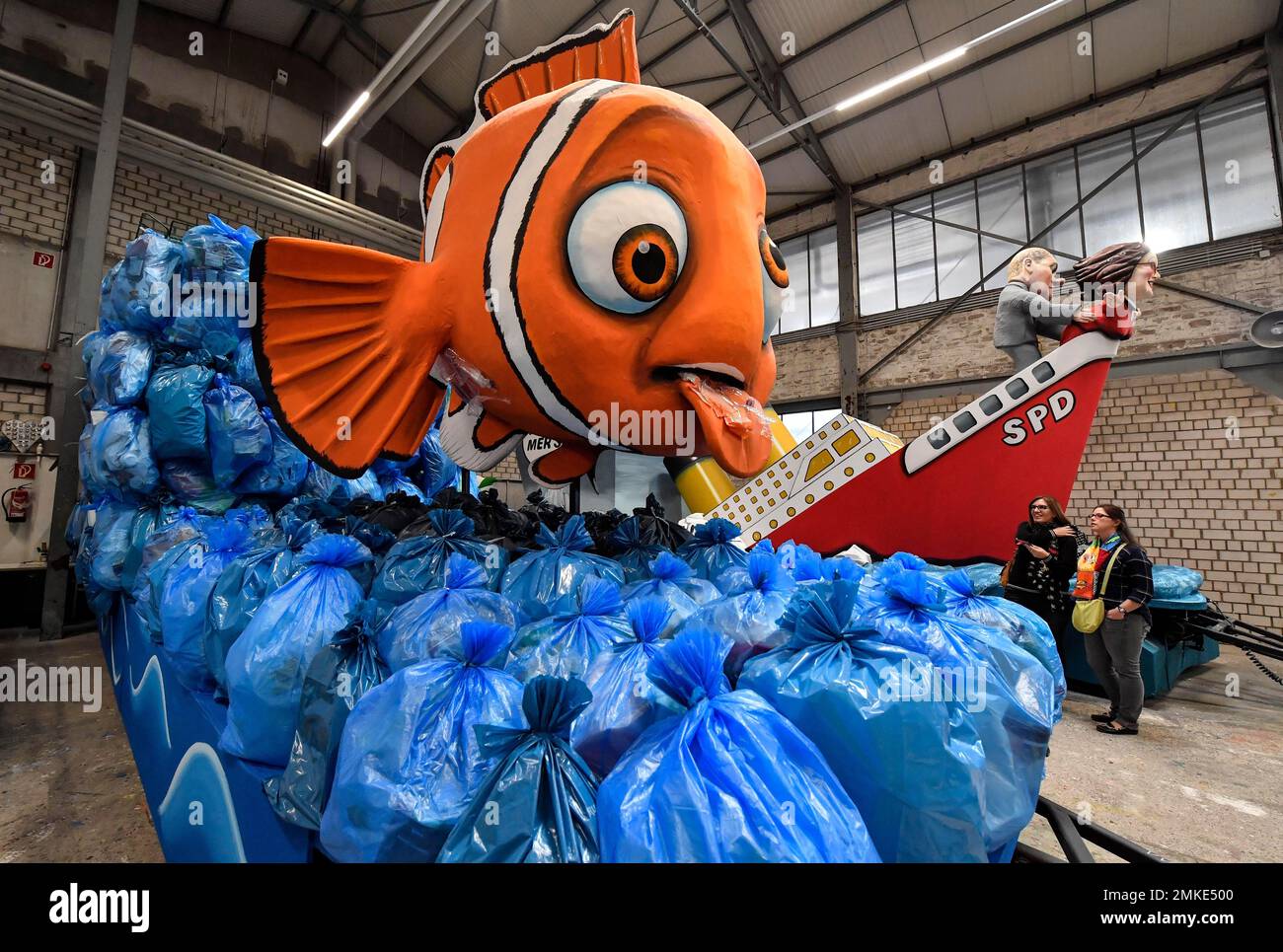 A satiric carnival float depicting the pollution of the ocean with ...