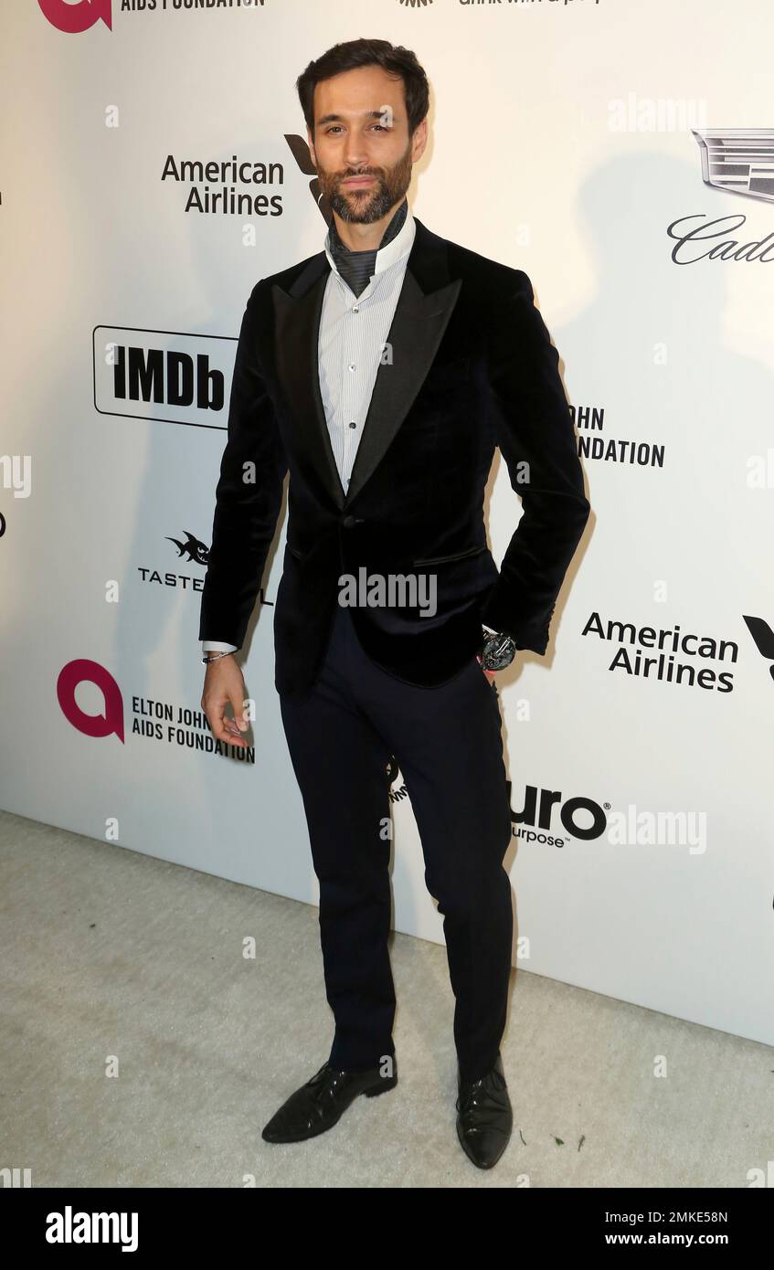 Rik Makarem arrive at the 2019 Elton John AIDS Foundation Oscar Viewing ...
