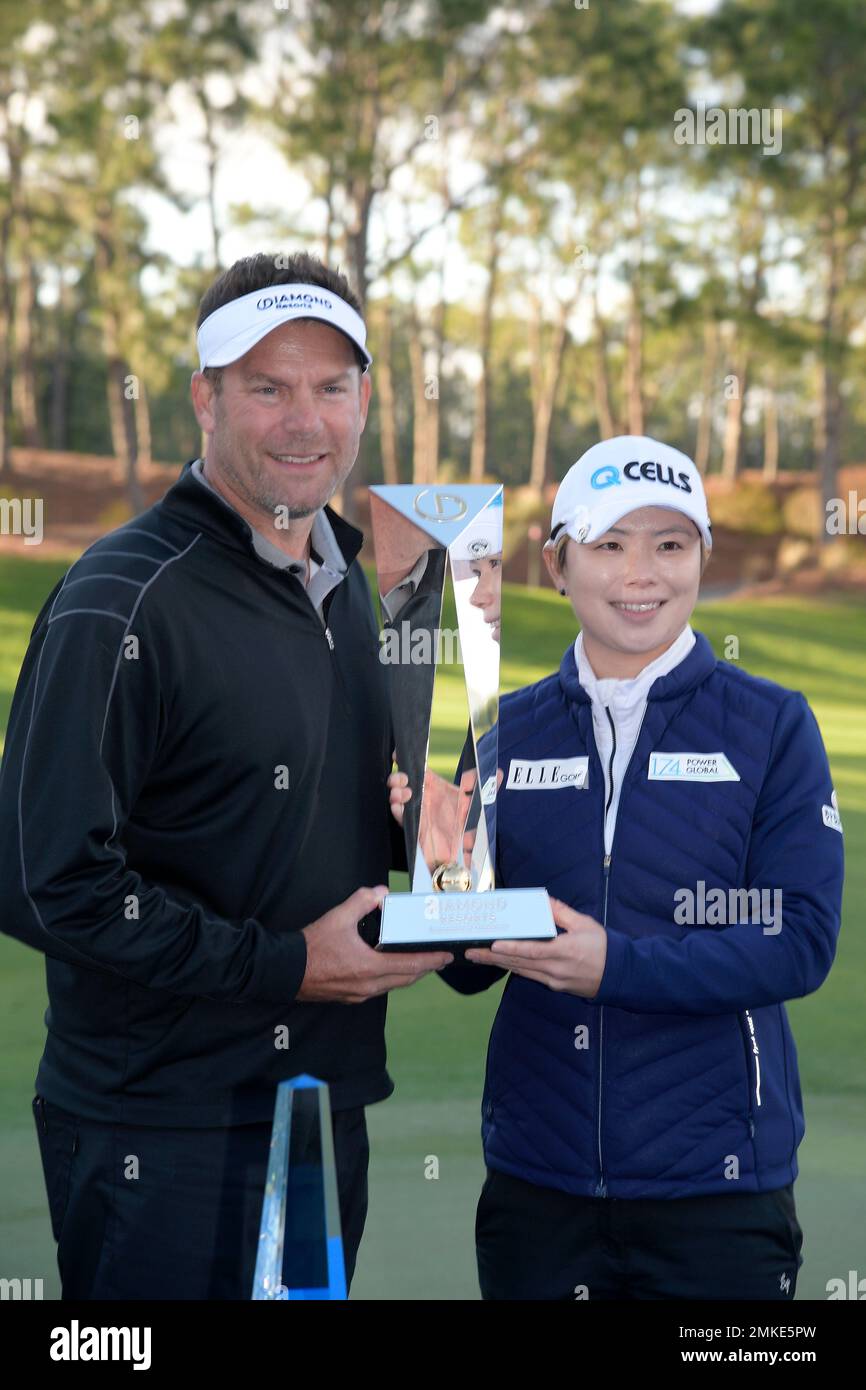 Michael Flaskey, CEO of Diamond Resorts International, left, poses with ...