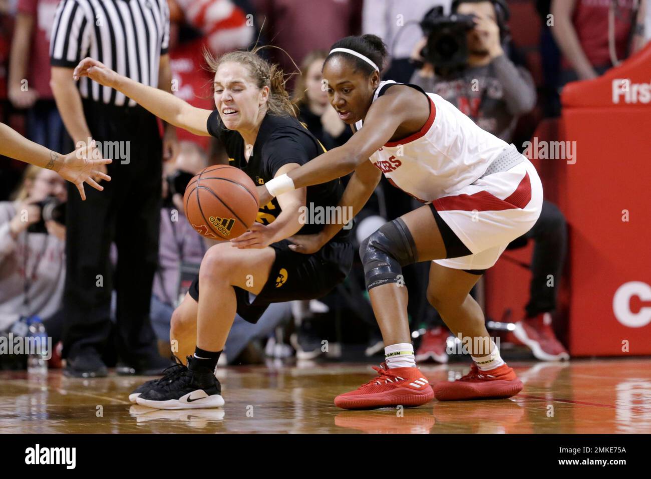 Iowa's Kathleen Doyle (22) attempts to steal the ball from Nebraska's ...