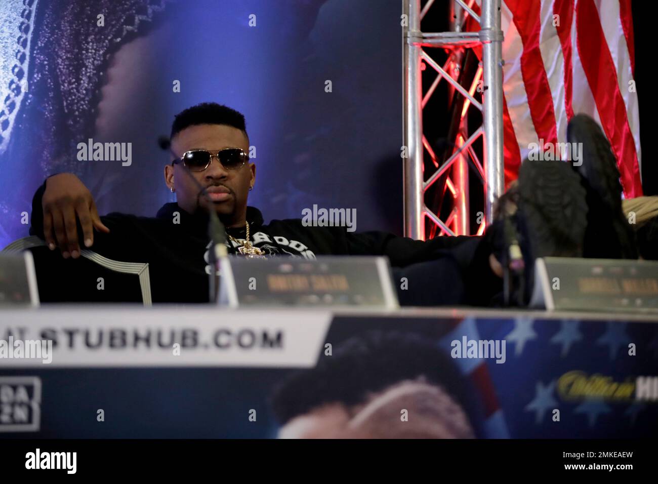 U.S. heavyweight boxer Jarrell Miller sits with his feet on the table ...