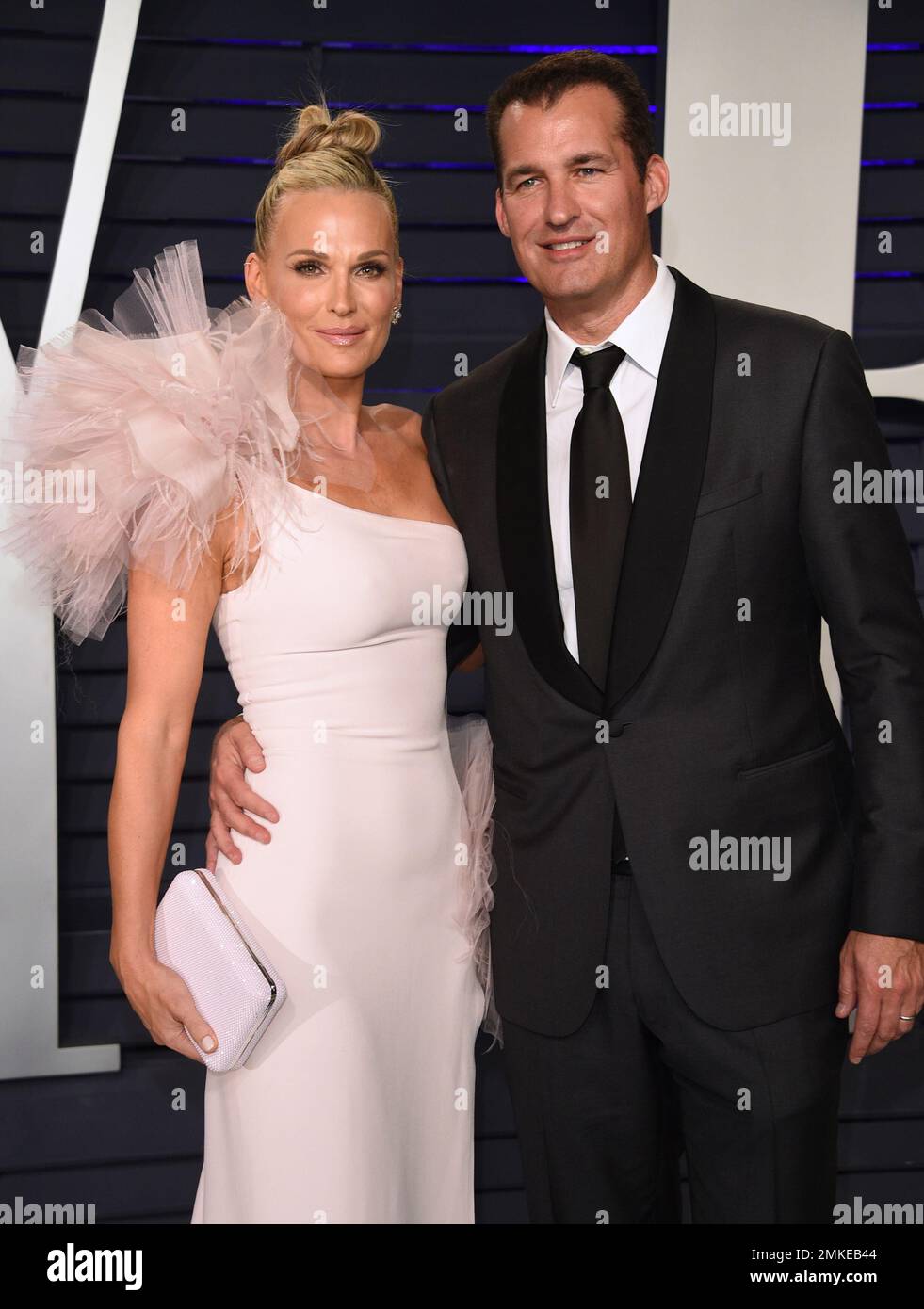 Molly Sims, left, and Scott Stuber arrive at the Vanity Fair Oscar ...