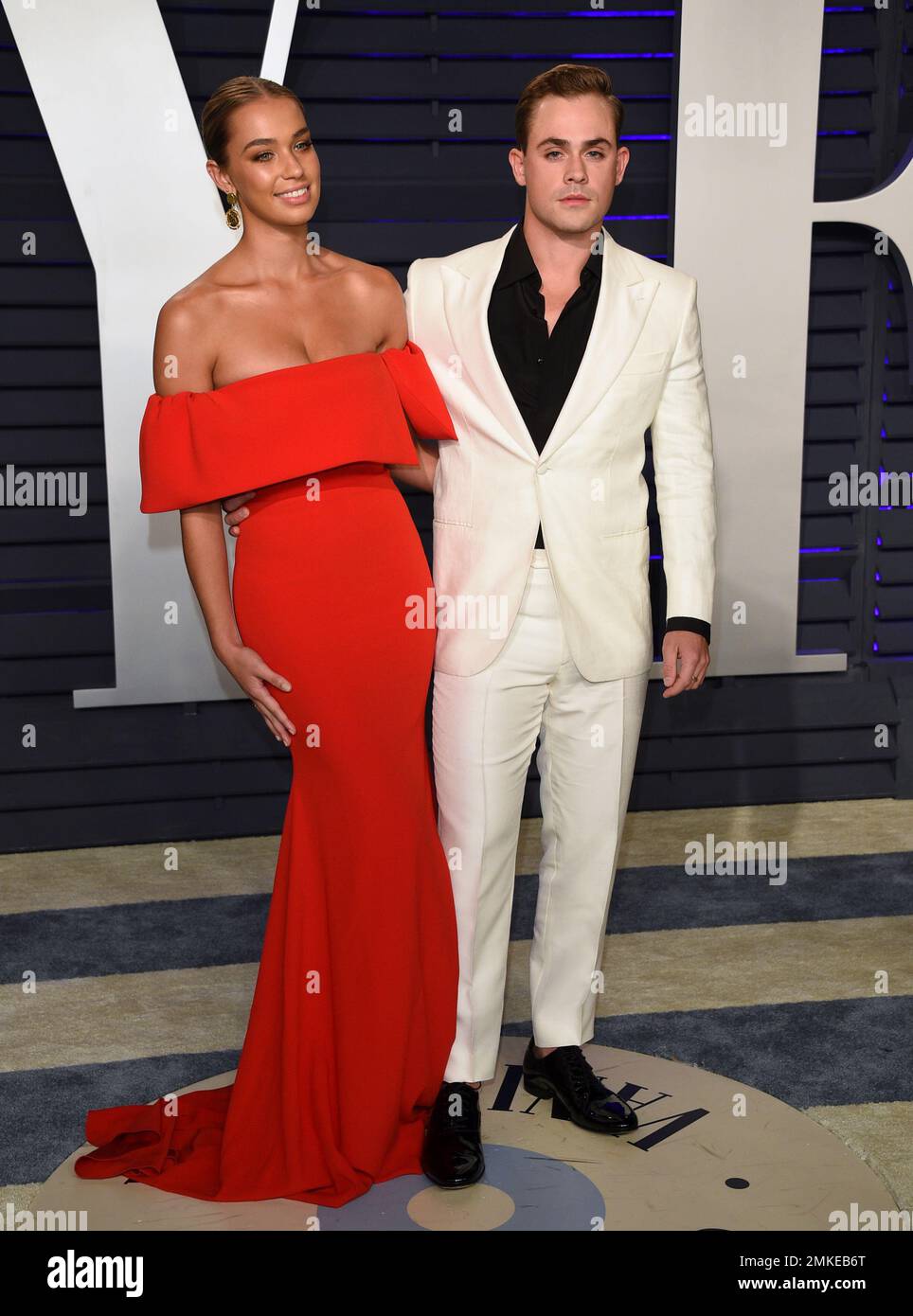 Liv Pollock, left, and Dacre Montgomery arrive at the Vanity Fair Oscar ...