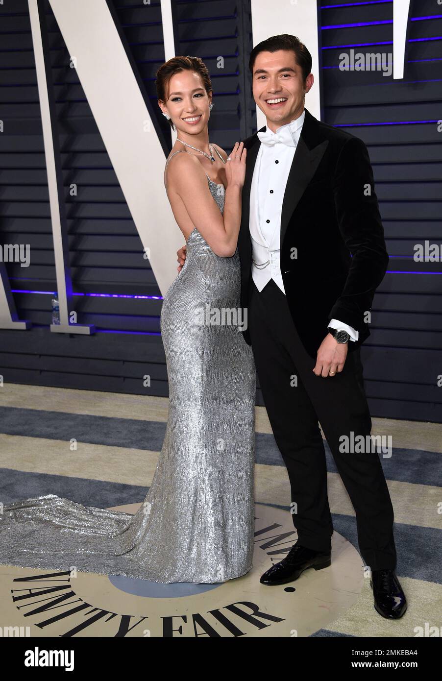 Henry Golding, right, and Liv Lo arrive at the Vanity Fair Oscar Party ...