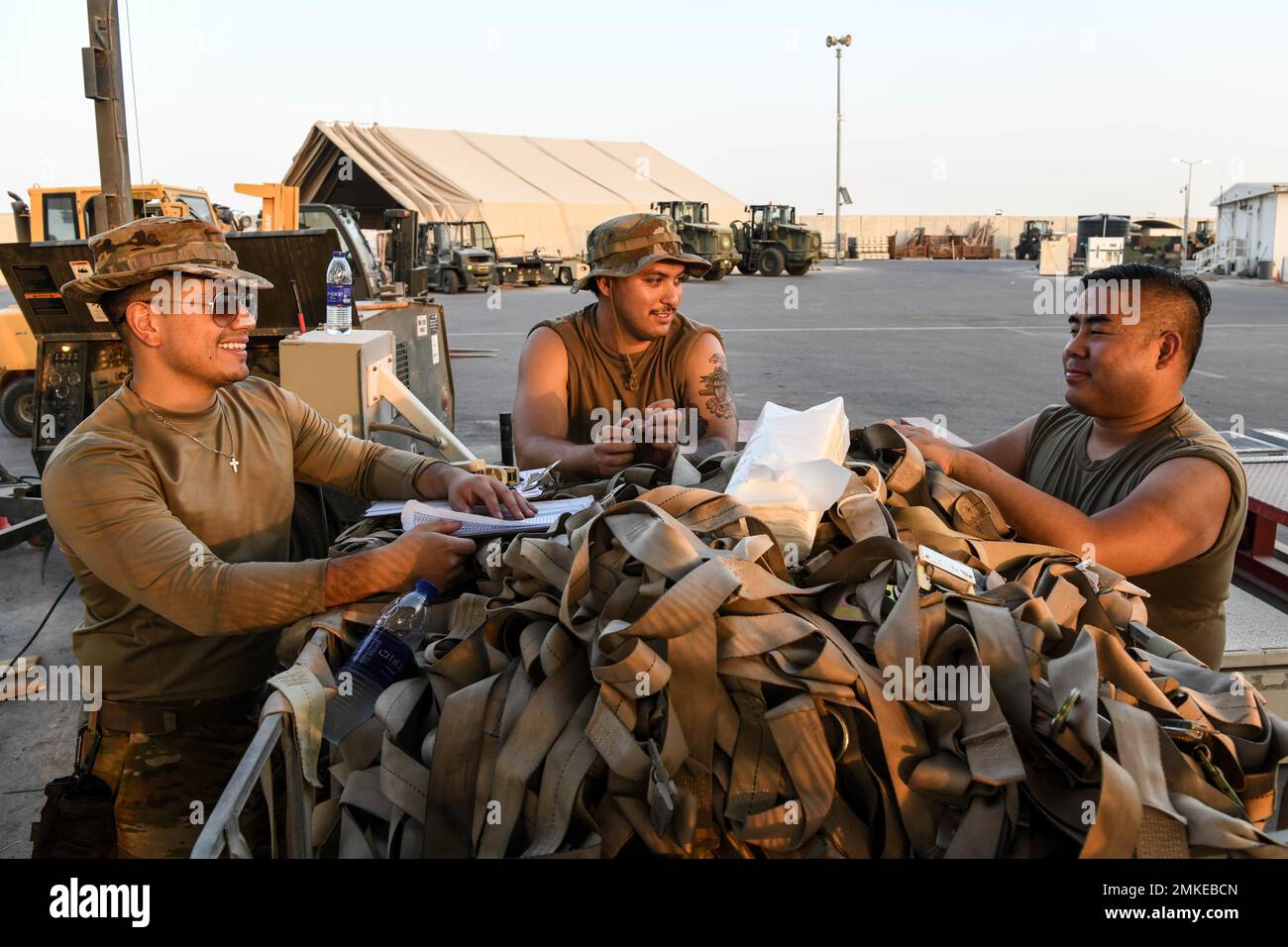 (From Left) Staff Sgt. Gary Montoya, a ramp operations specialist ...