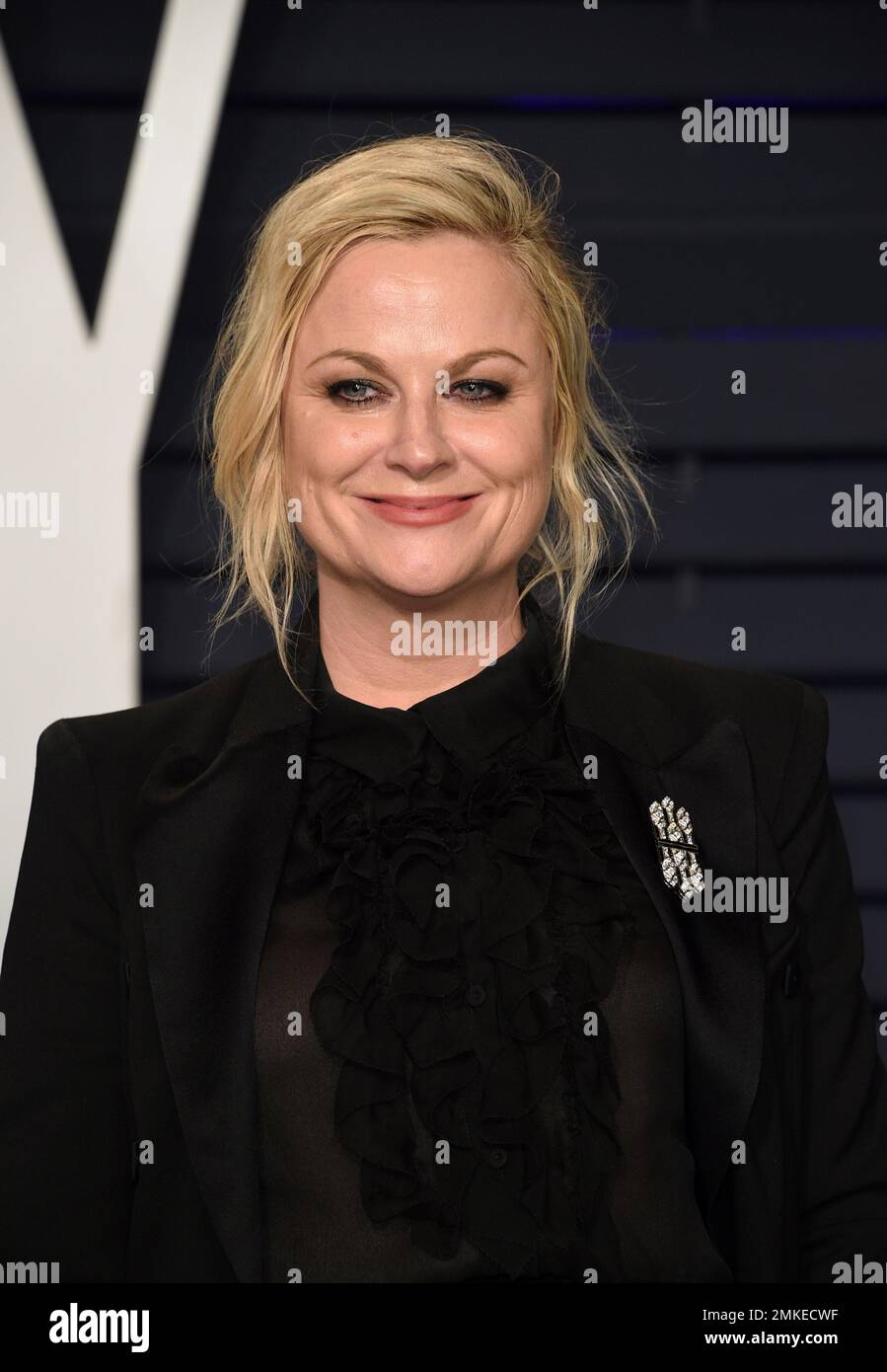 Amy Poehler arrives at the Vanity Fair Oscar Party on Sunday, Feb. 24 ...
