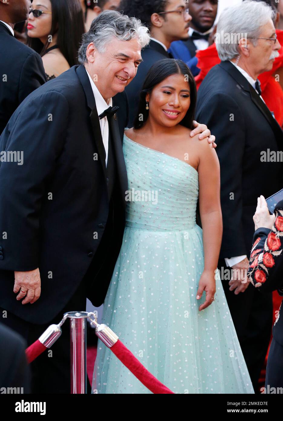 Gregory Nava, left, and Yalitza Aparicio arrive at the Oscars on Sunday ...