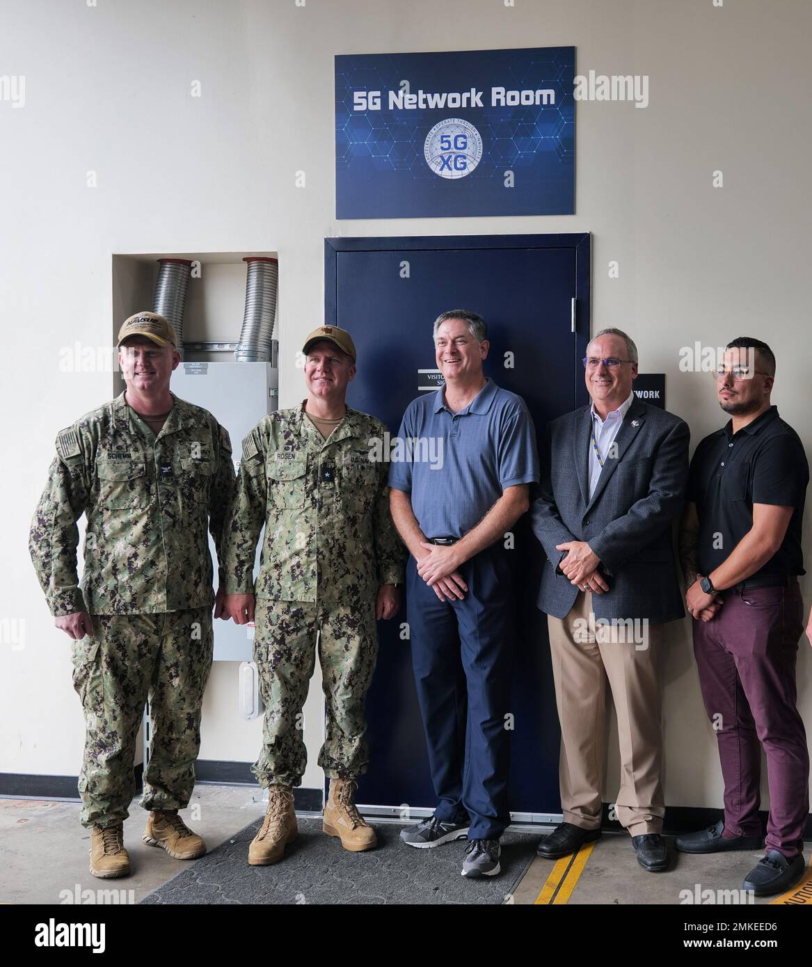 Guests gather for a group photo with Rear. Adm. Bradley Rosen,Commander ...