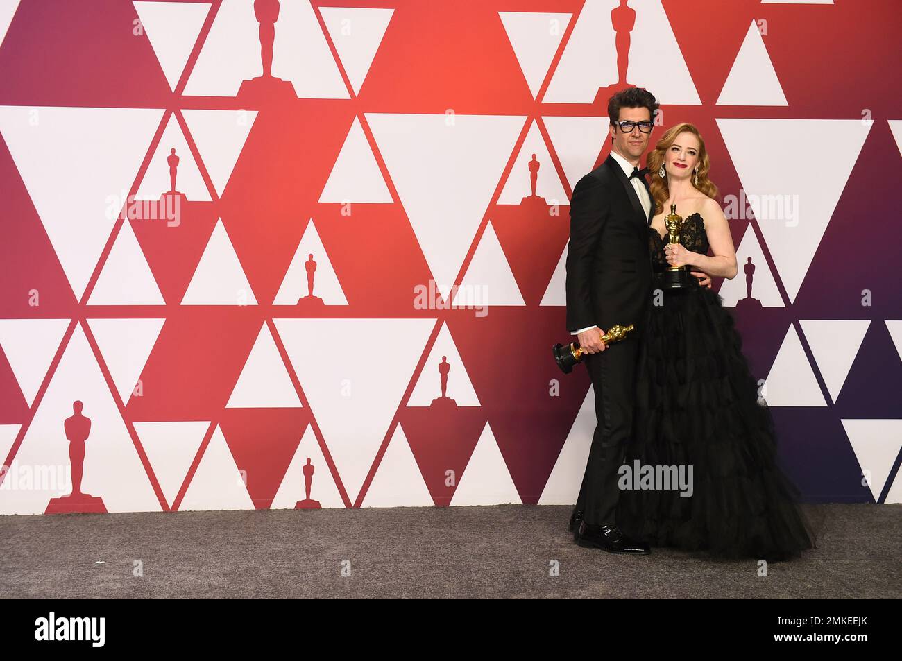 Guy Nattiv, left, and Jaime Ray Newman pose with award for best live ...
