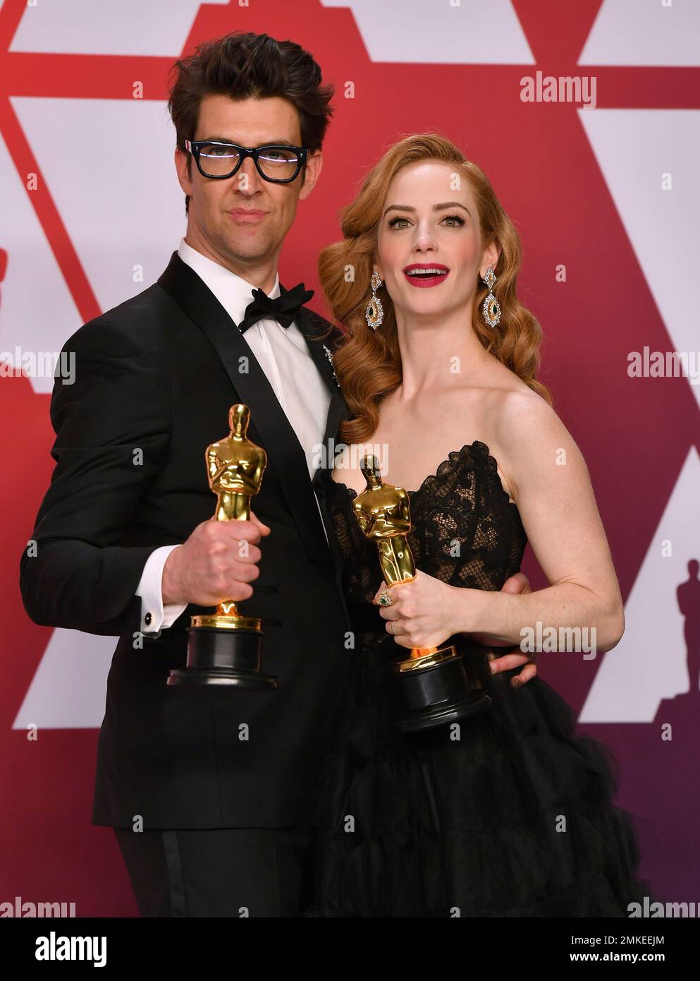 Guy Nattiv, left, and Jaime Ray Newman pose with award for best live ...