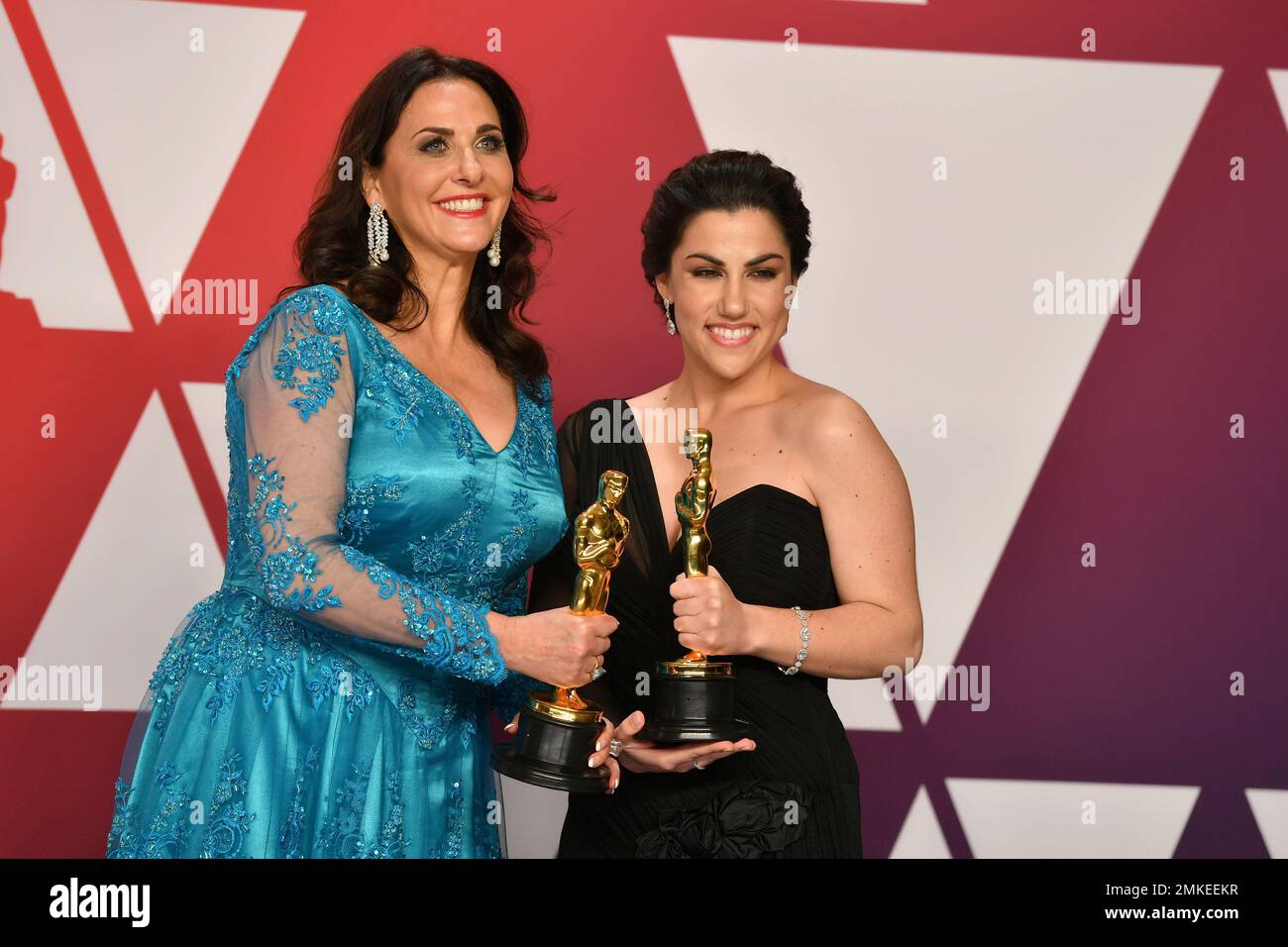 Melissa Berton, left, and Rayka Zehtabchi pose with the award for best ...