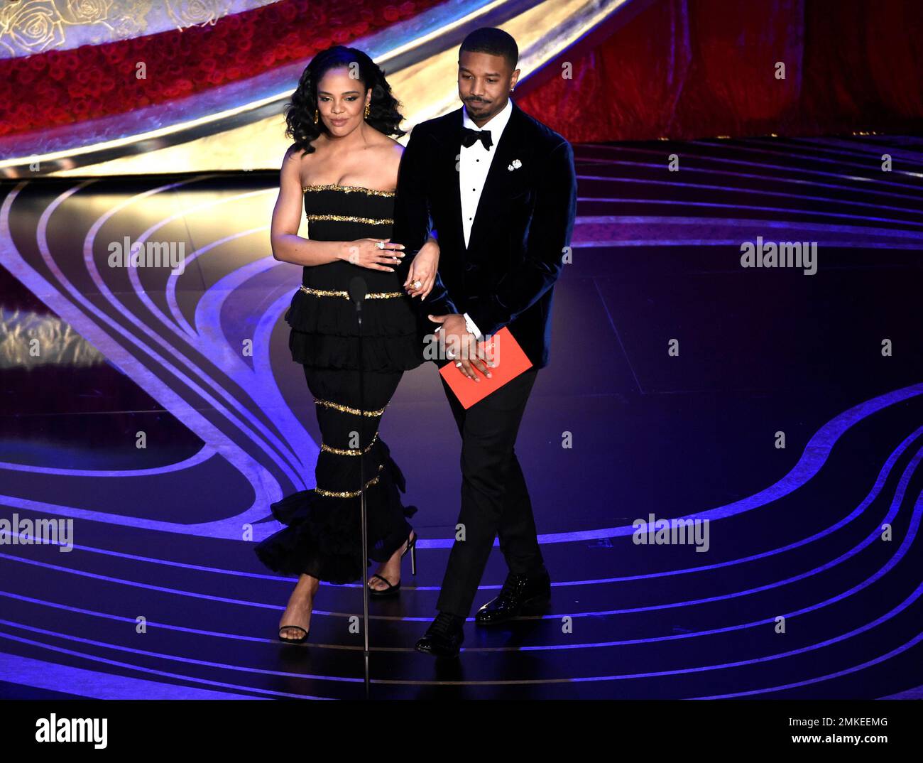 Tessa Thompson, left, and Michael B. Jordan walk on stage to present ...