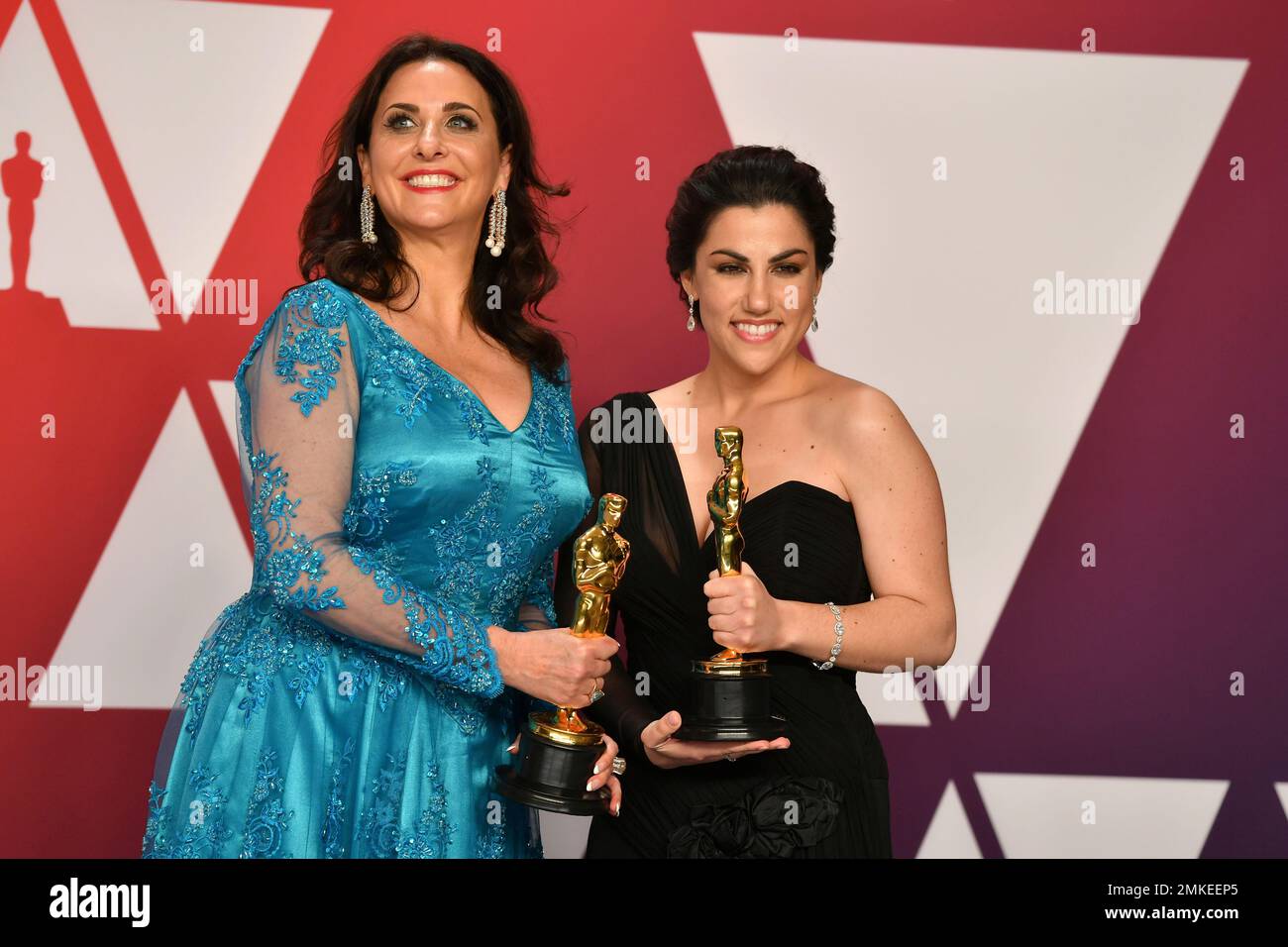 Melissa Berton, left, and Rayka Zehtabchi pose with the award for best ...