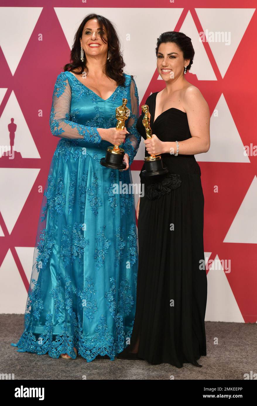Melissa Berton, left, and Rayka Zehtabchi pose with the award for best ...
