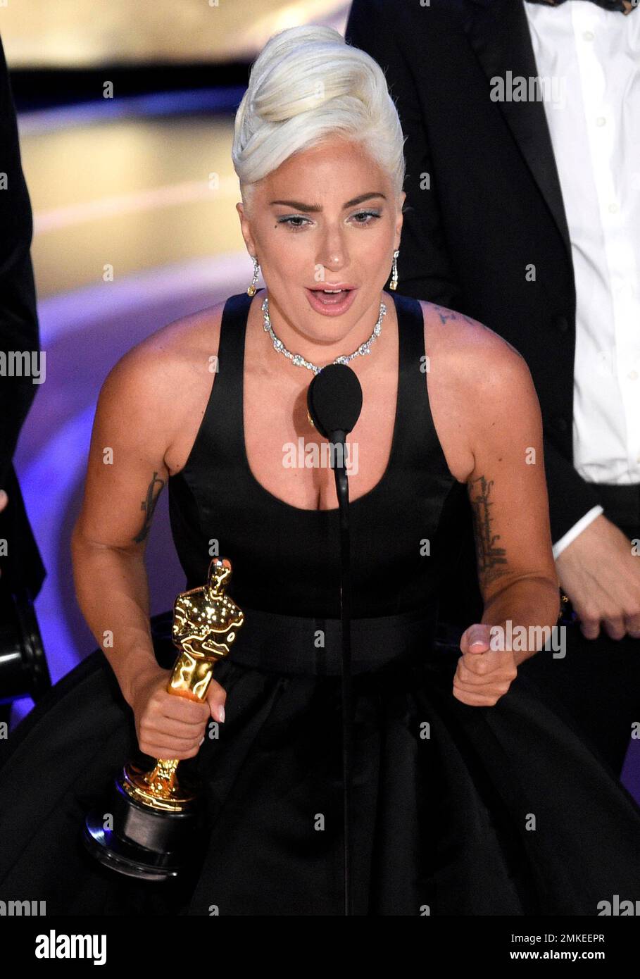 Lady Gaga accepts the award for best original song for "Shallow" from ...