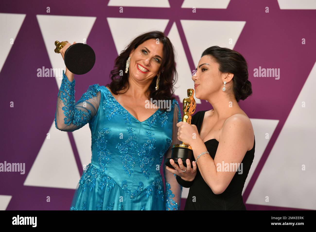 Melissa Berton, left, and Rayka Zehtabchi pose with the award for best ...