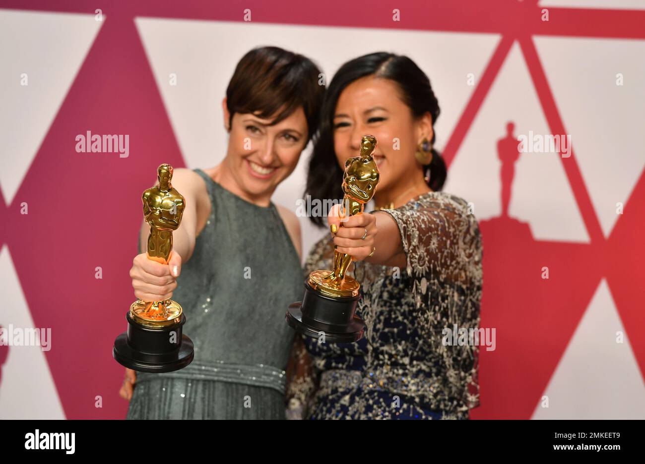 Becky Neiman-Cobb, left, and Domee Shi pose with the award for best ...