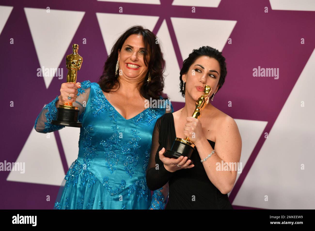 Melissa Berton, left, and Rayka Zehtabchi pose with the award for best ...