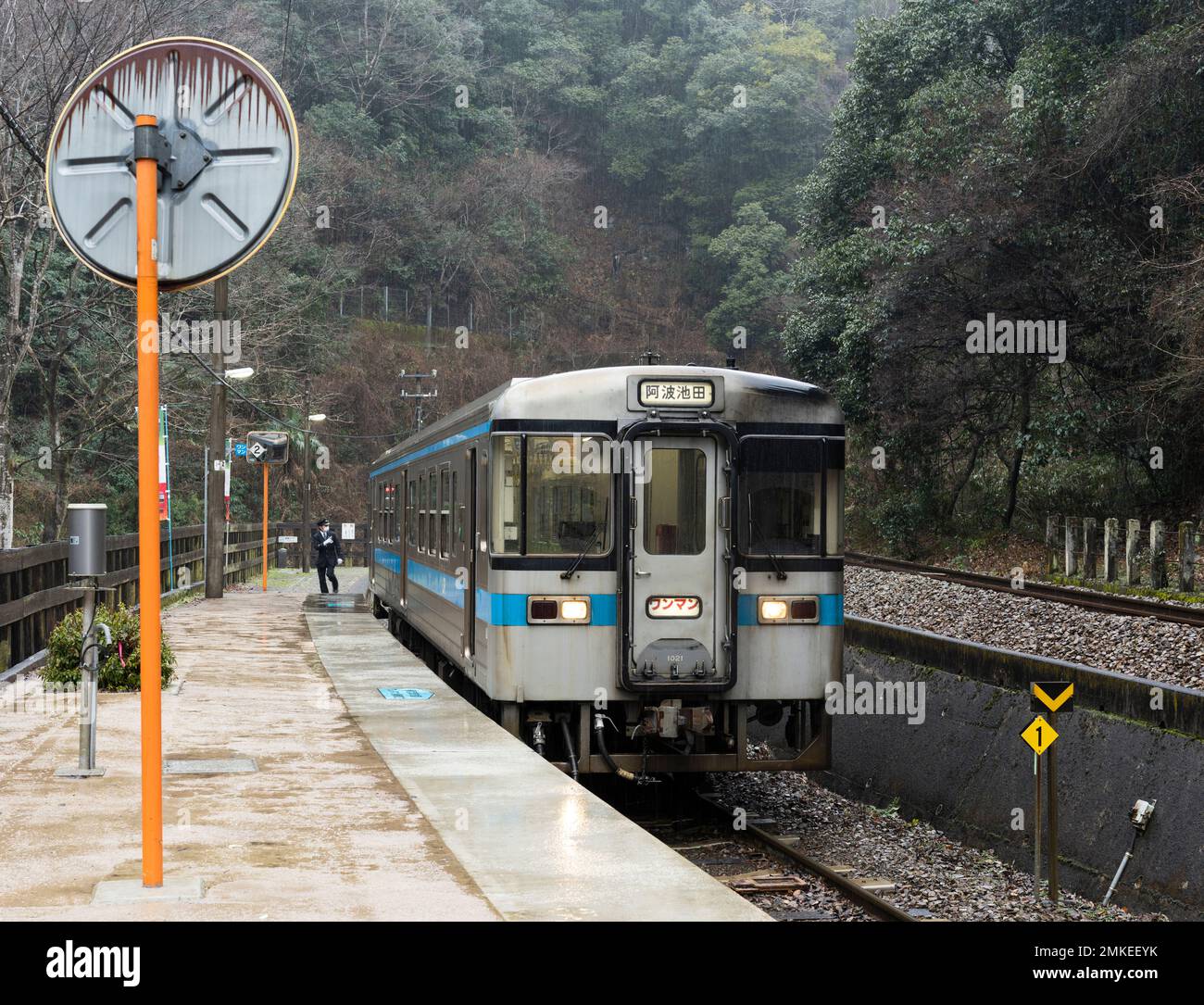 A JR Shikoku 1000 Series local train at Tsubojiri Station on the Dosan ...