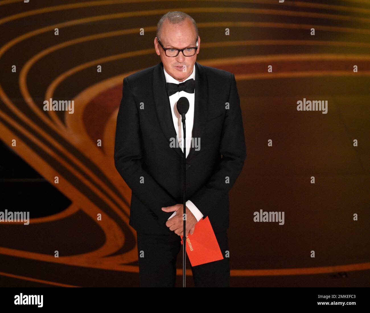 Michael Keaton presents the award for best film editing at the Oscars ...