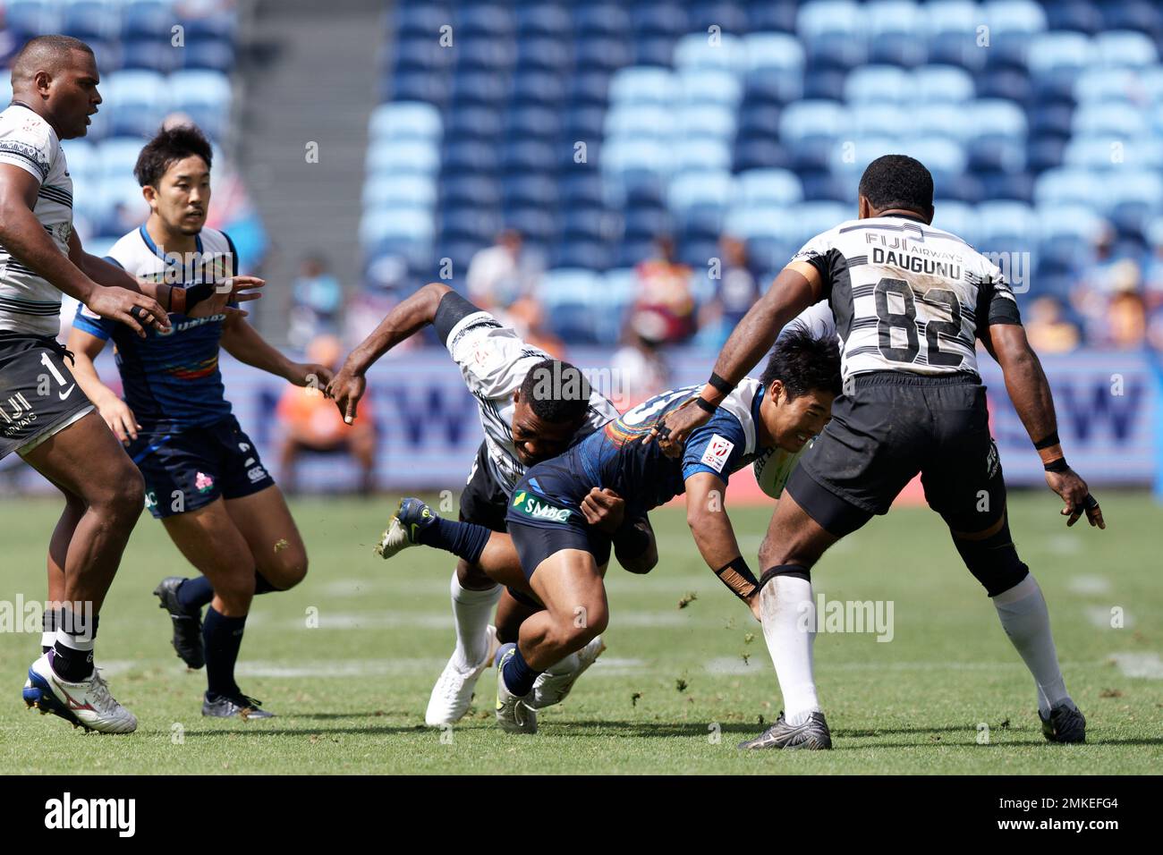 Sydney, Australia. 28th Jan, 2023. Junya Matsumoto of Japan is tackled ...