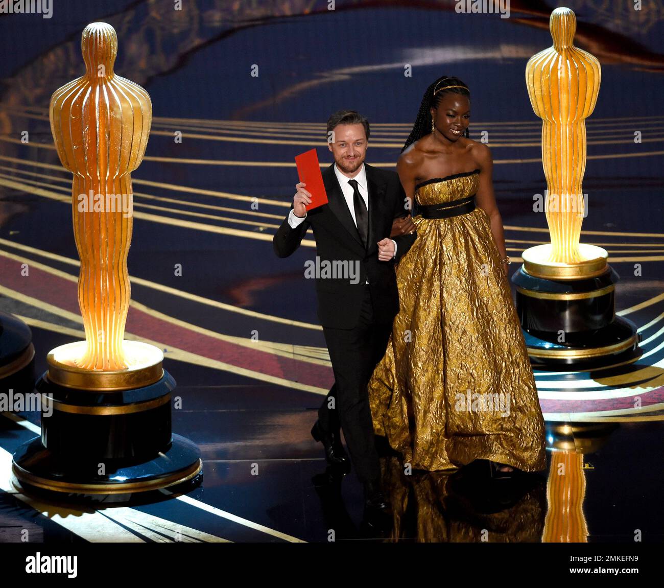 James McAvoy, left, and Danai Gurira walk on stage to present the award ...