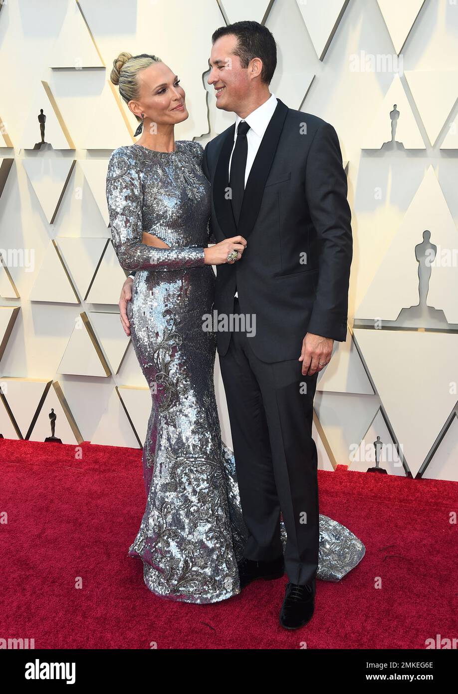 Molly Sims, left, and Scott Stuber arrives at the Oscars on Sunday, Feb ...