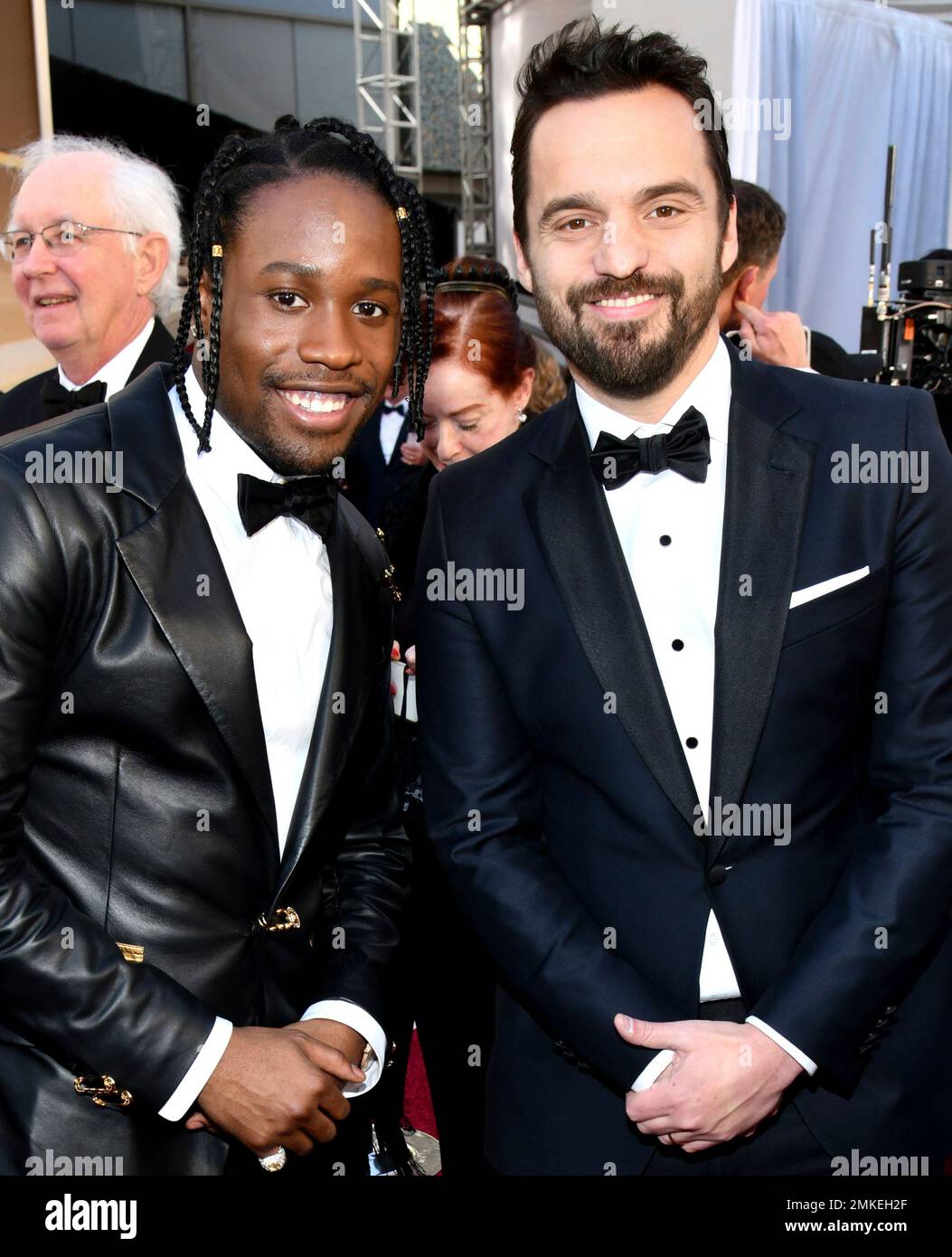 Shameik Moore, left, and Jake Johnson arrive at the Oscars on Sunday ...