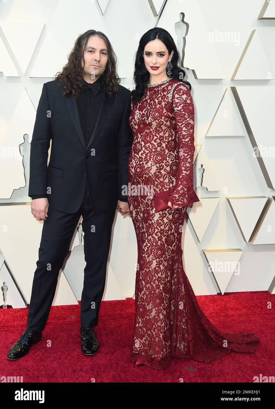 Krysten Ritter, right, and Adam Granduciel arrive at the Oscars on ...