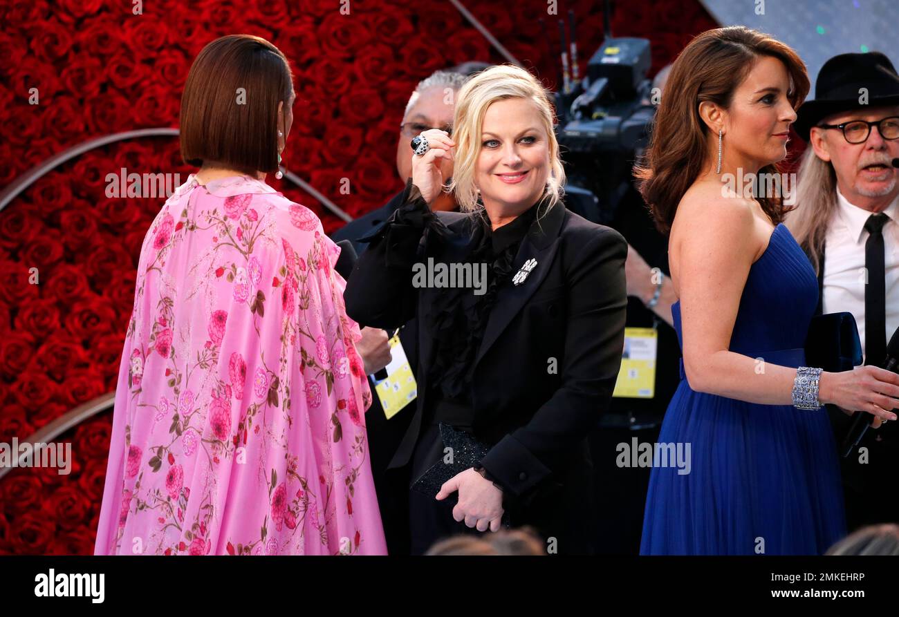 Maya Rudolph, from left, Amy Poehler and Tina Fey arrive at the Oscars ...