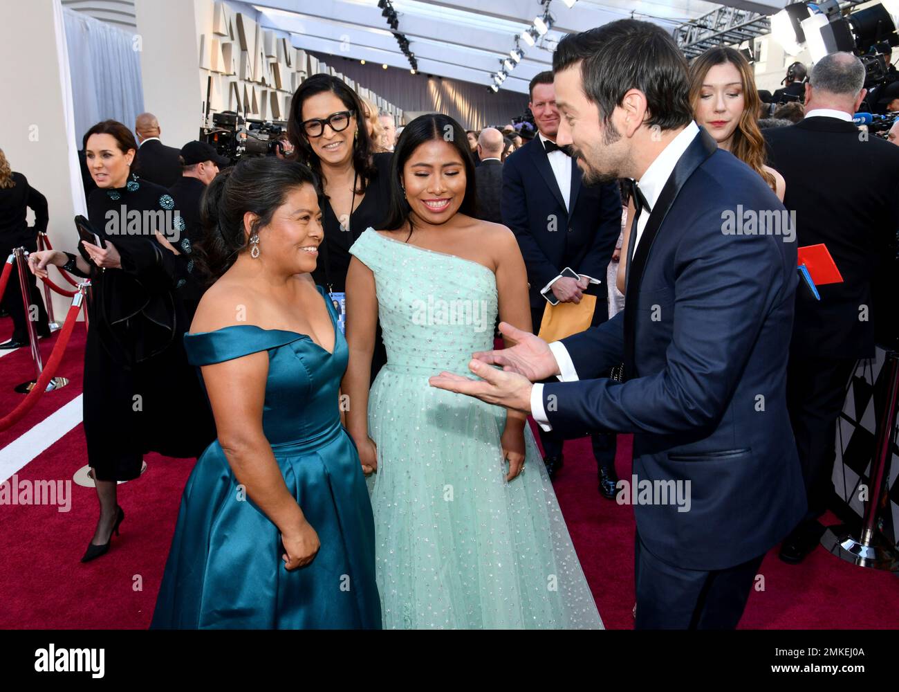 Margarita Martinez Merino, left, speaks with Diego Luna, right, as ...