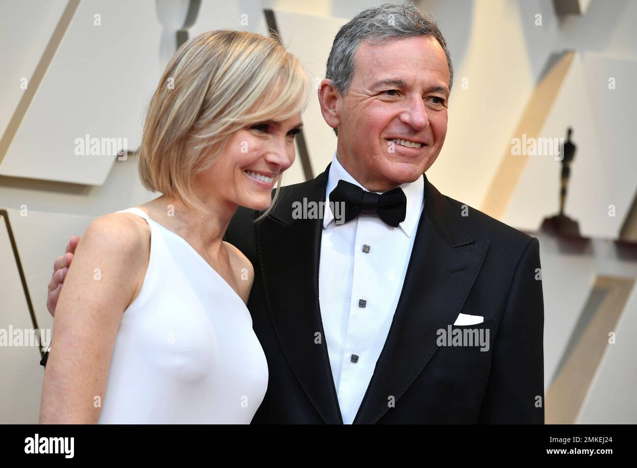 Willow Bay, left, and Robert Iger arrive at the Oscars on Sunday, Feb ...