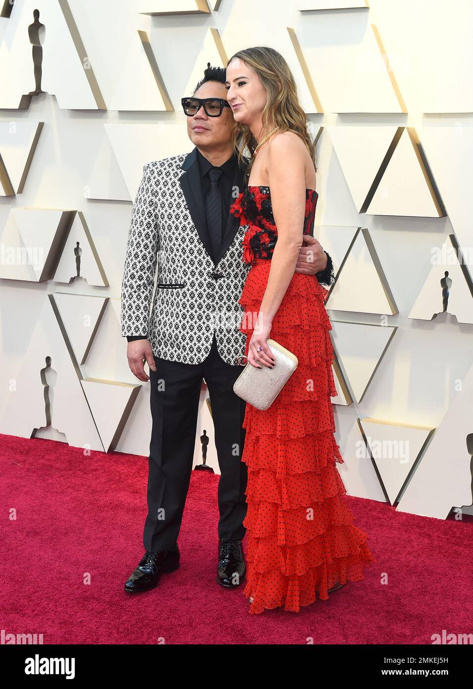 Matthew Libatique, left, and Magela Crosignani arrive at the Oscars on ...