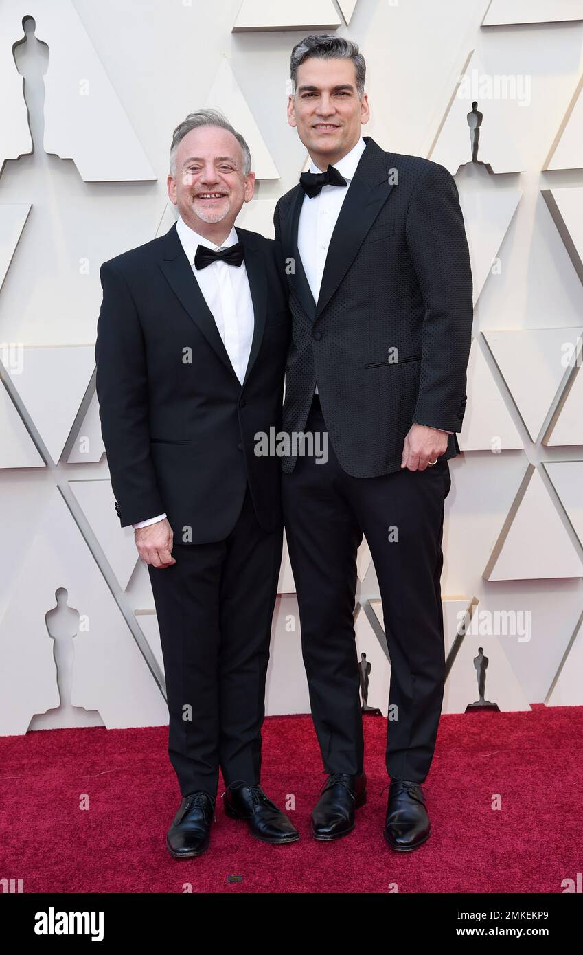 Marc Shaiman, left and Louis Mirabal arrive at the Oscars on Sunday ...