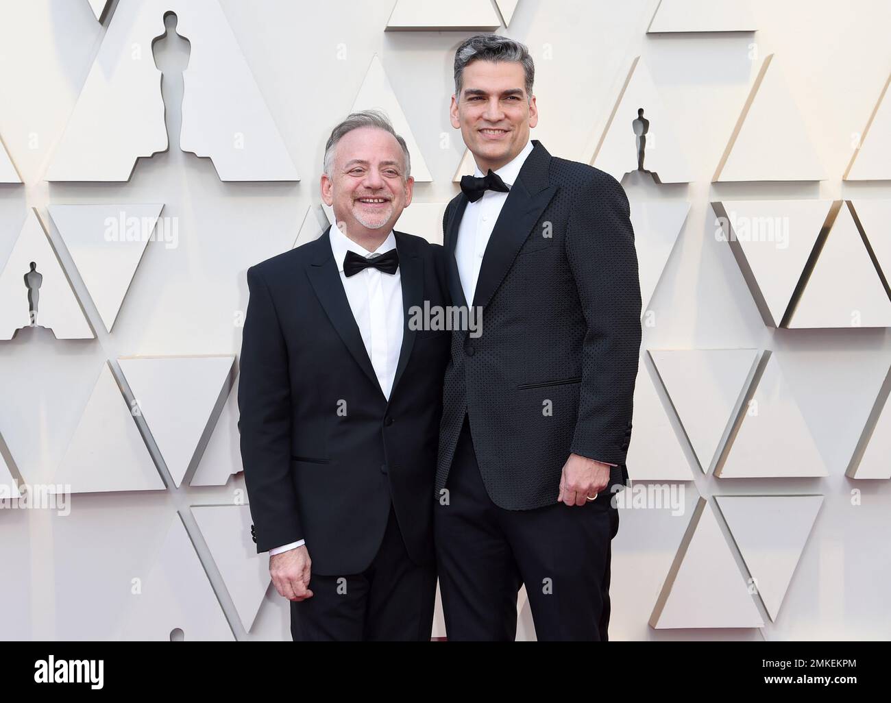 Marc Shaiman, left and Louis Mirabal arrive at the Oscars on Sunday ...