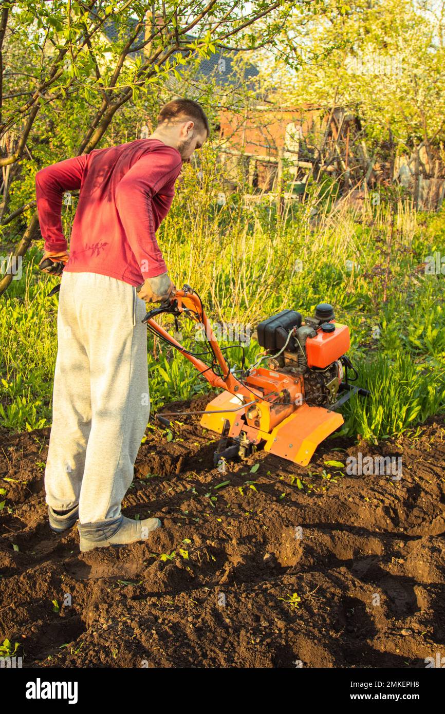 Man plows field walk hi-res stock photography and images - Alamy