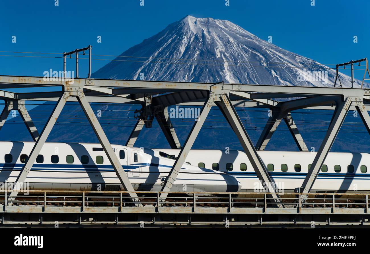 JR Central N700 trains on the Tokaido Shinkansen Line cross a bridge over the Fuji River ...