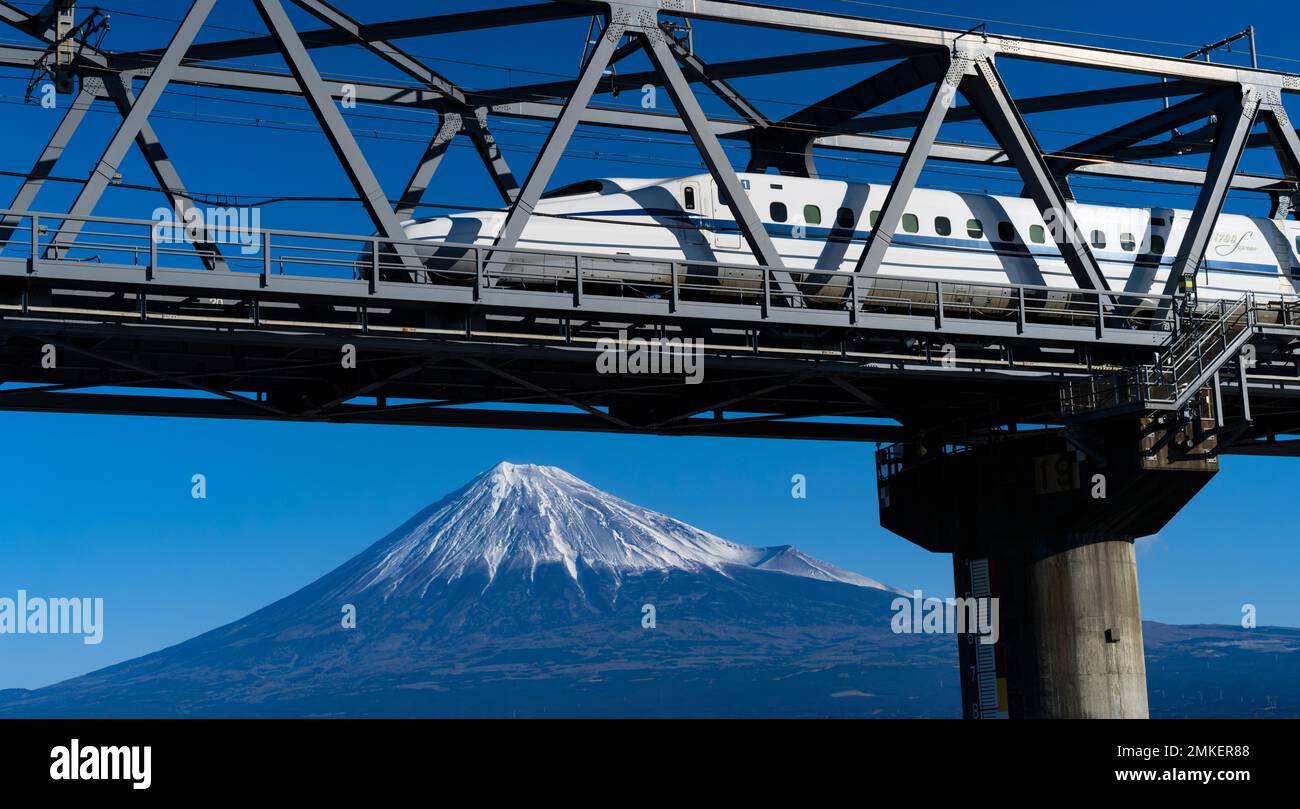 A JR Central N700S train on the Tokaido Shinkansen Line crosses a bridge over the Fuji River ...