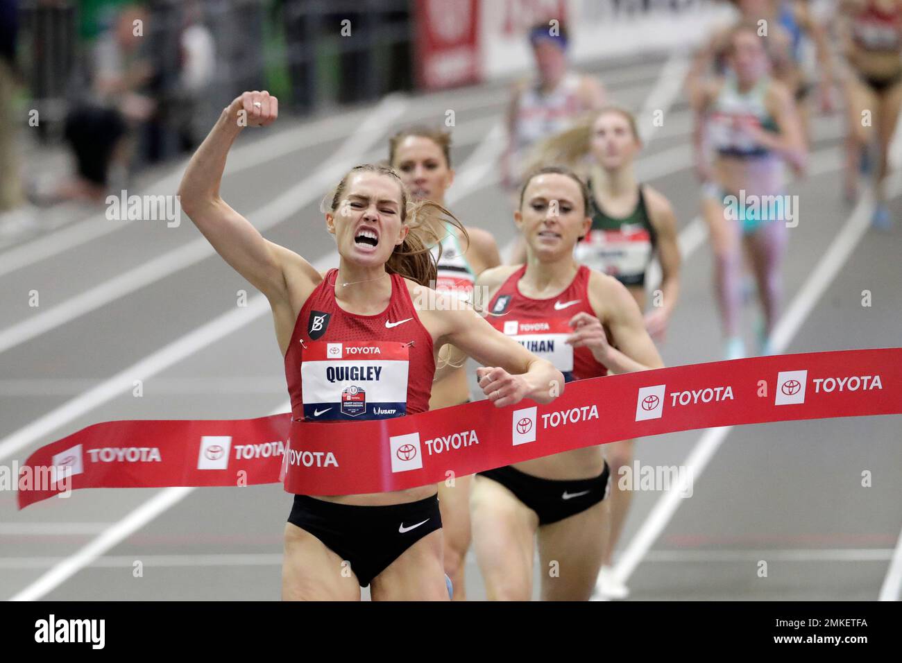 Colleen Quigley reacts as she breaks the tape to win the women's mile ...