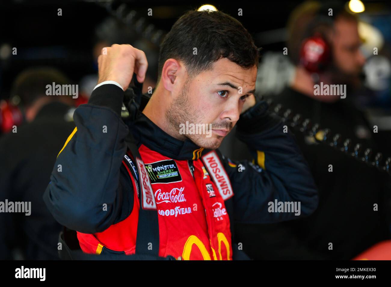 Driver Chad Finchum gets ready for practice while in the garage before ...