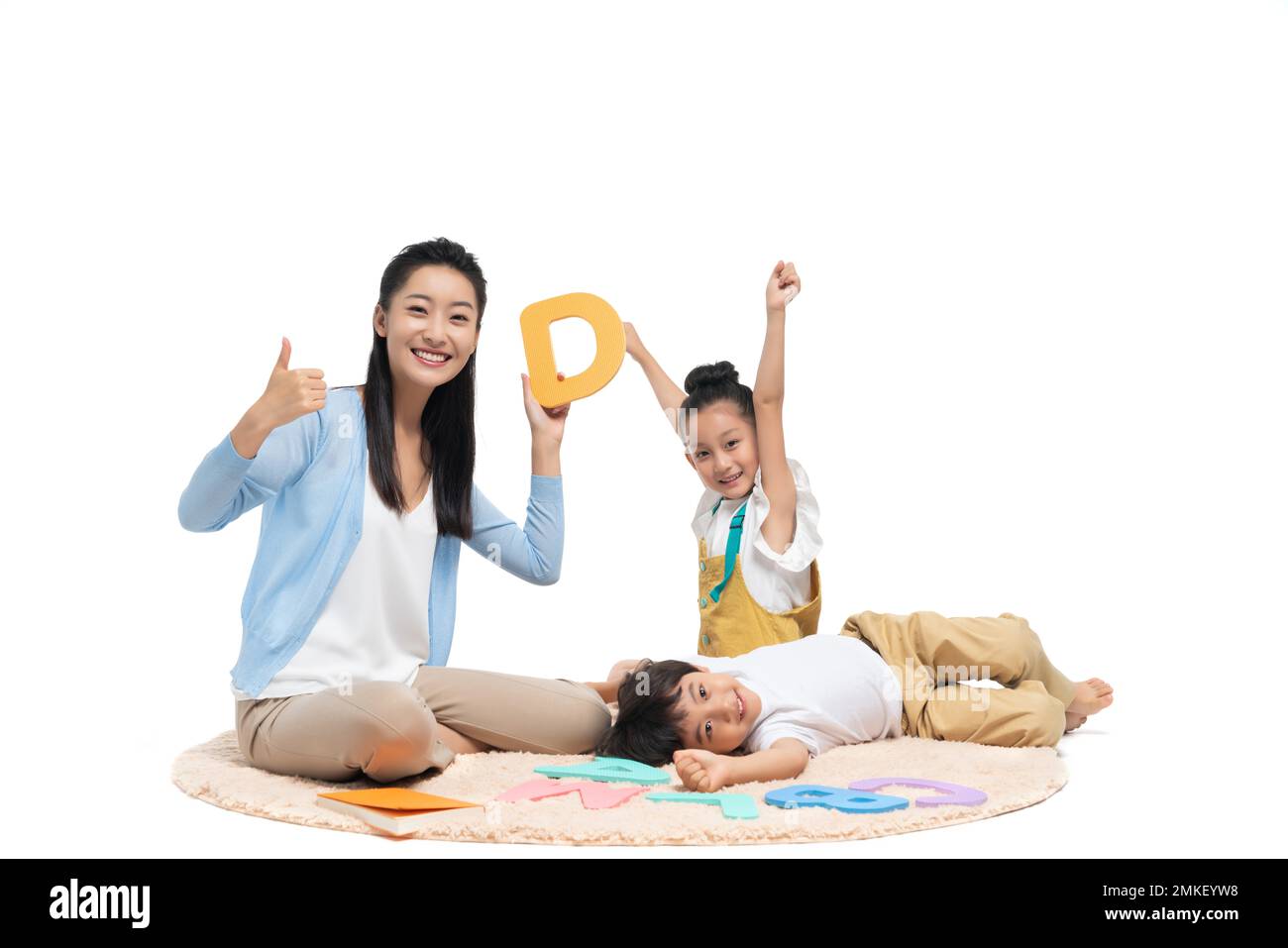A young female teacher counseling students learning Stock Photo - Alamy