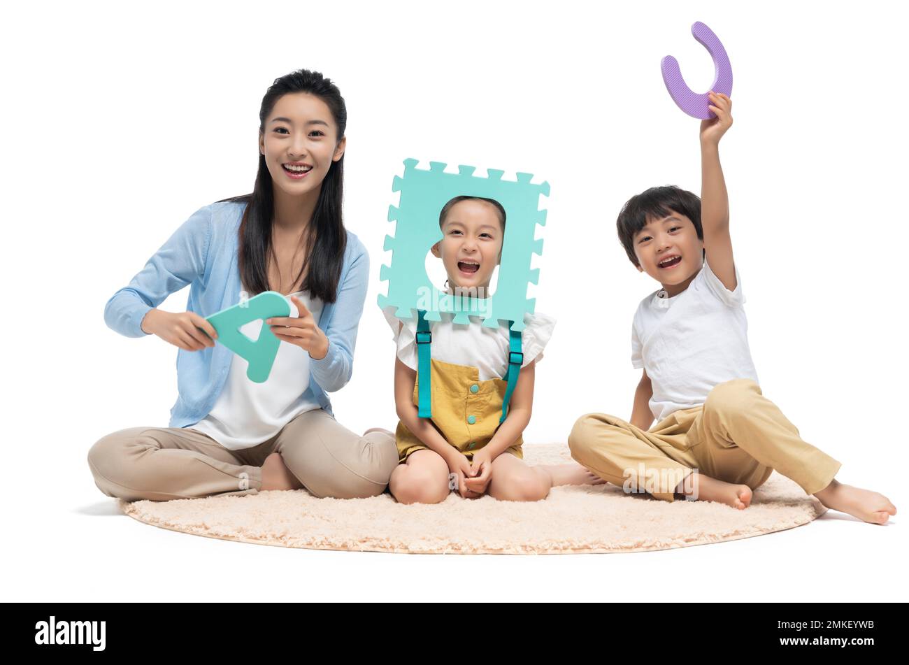 A young female teacher counseling students learning Stock Photo - Alamy