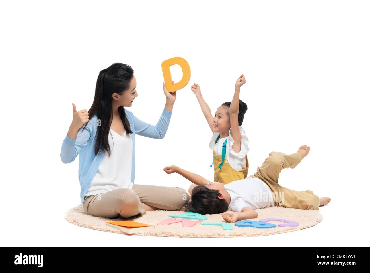 A young female teacher counseling students learning Stock Photo - Alamy