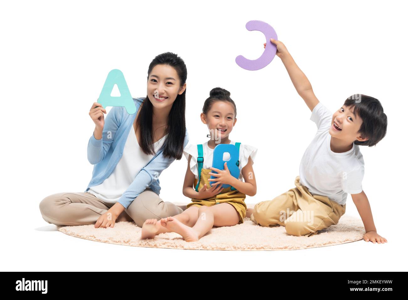 A young female teacher counseling students learning Stock Photo - Alamy