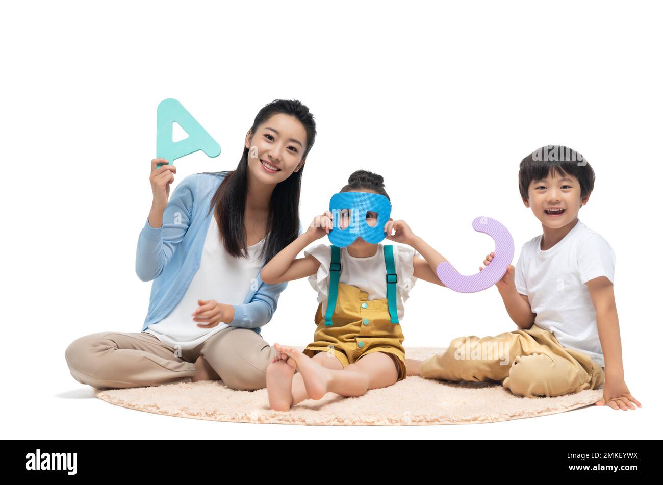 A young female teacher counseling students learning Stock Photo - Alamy
