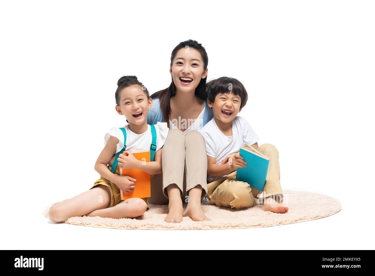 A young female teacher counseling students learning Stock Photo - Alamy